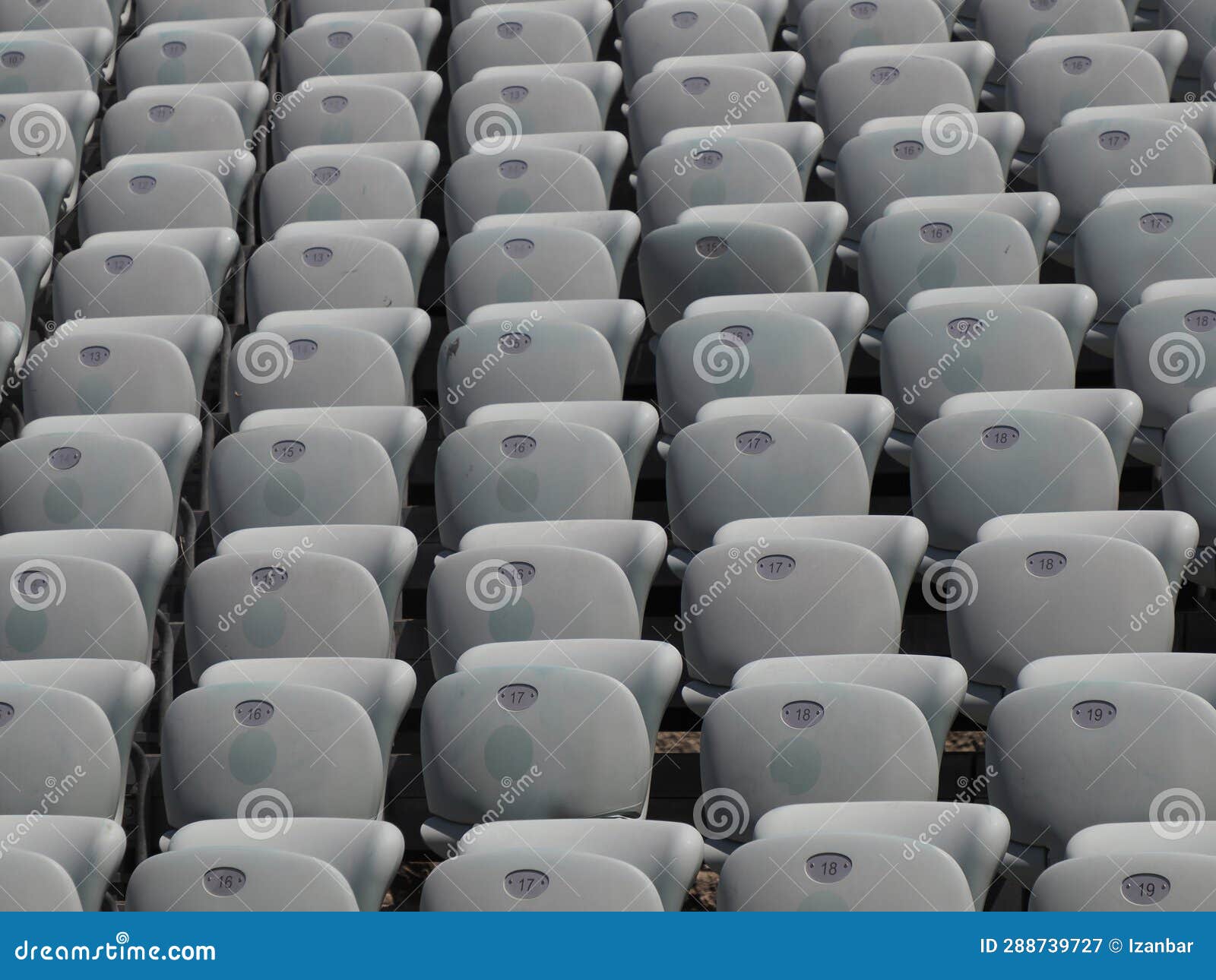Rows of Numbered Empty Plastic Seats at an Open-air Amphitheater. Many ...