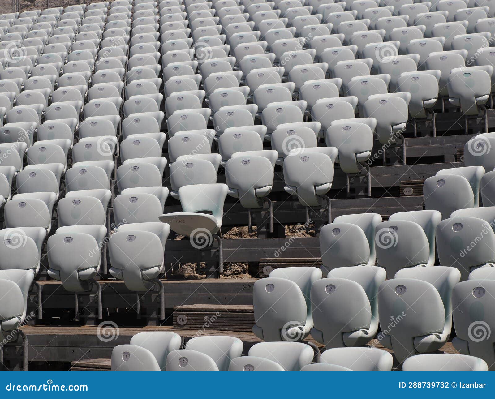 Rows of Numbered Empty Plastic Seats at an Open-air Amphitheater. Many ...