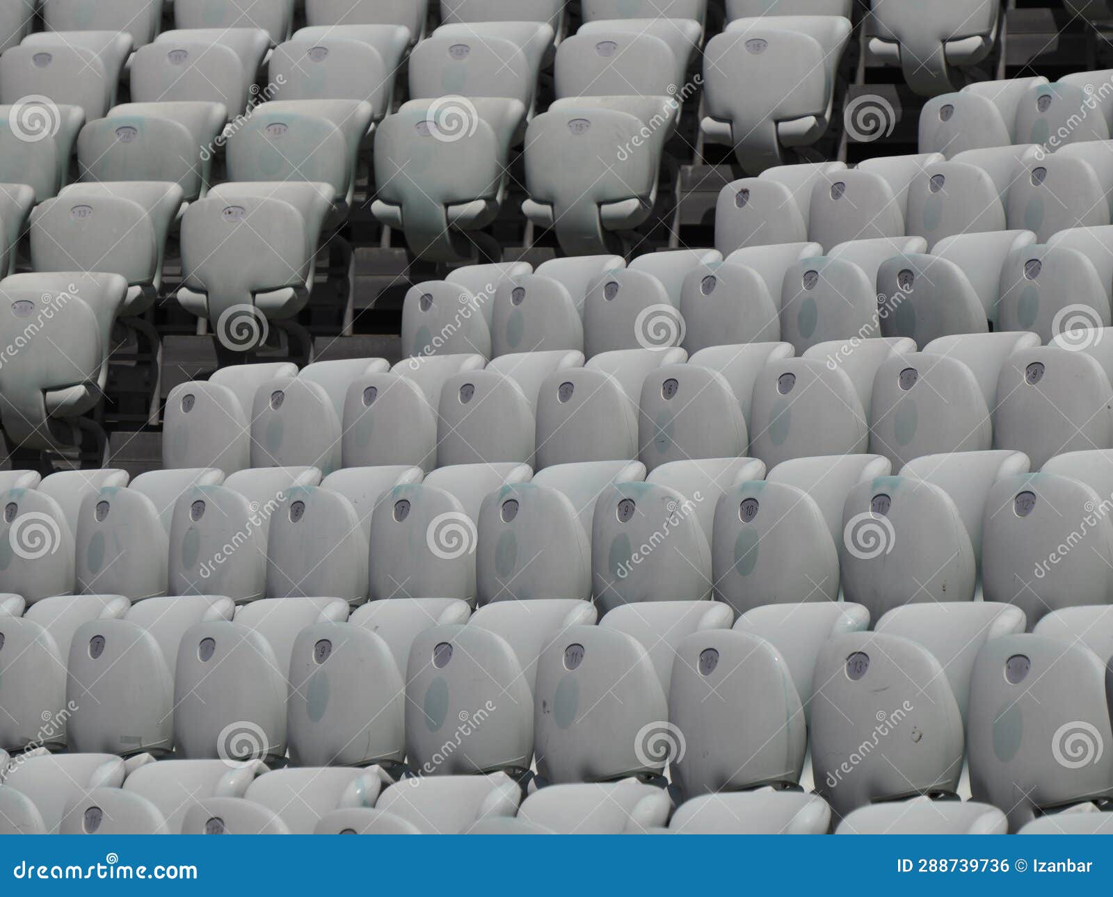 Rows of Numbered Empty Plastic Seats at an Open-air Amphitheater. Many ...