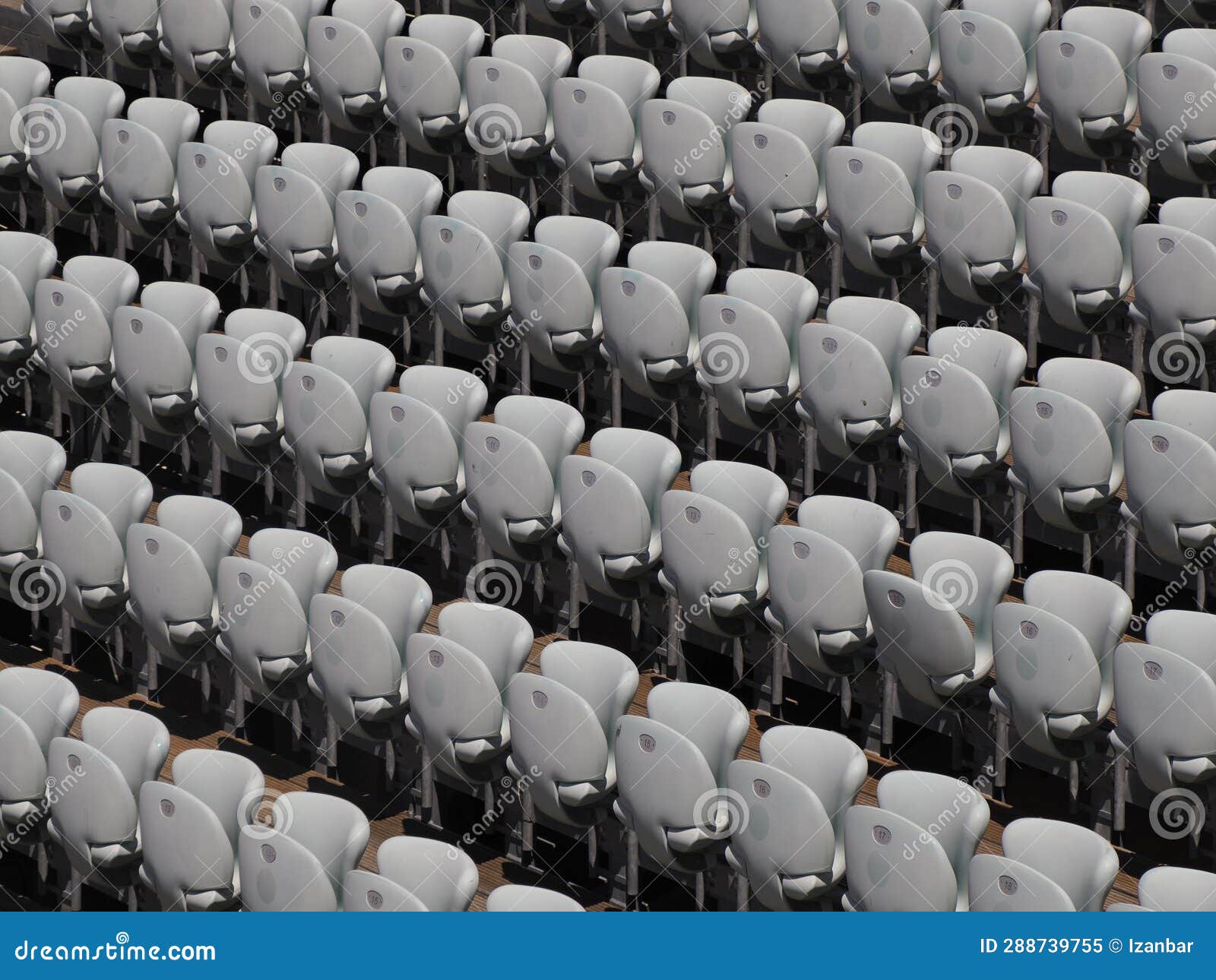Rows of Numbered Empty Plastic Seats at an Open-air Amphitheater. Many ...
