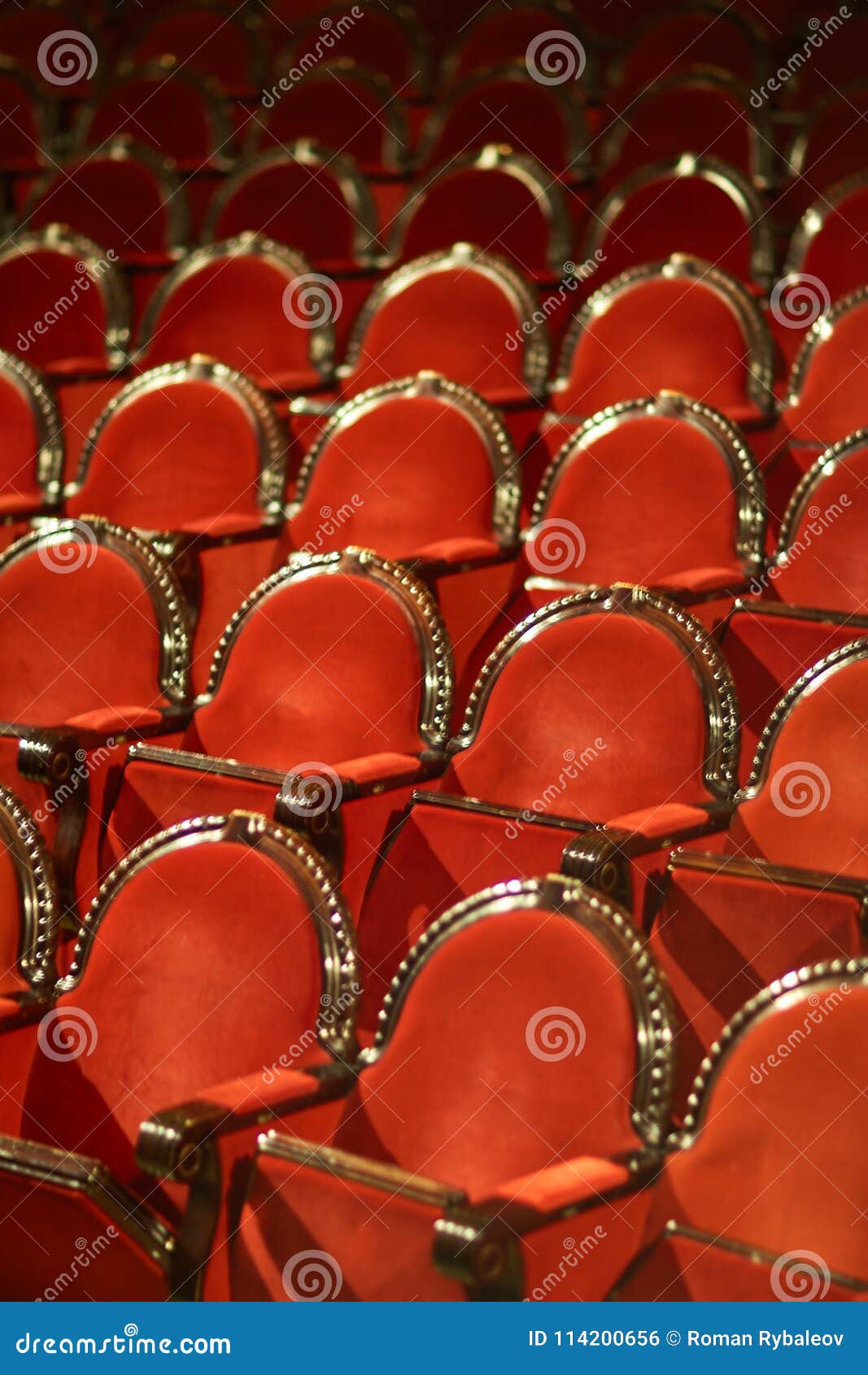 Rows of red chairs stock photo. Image of background - 114200656