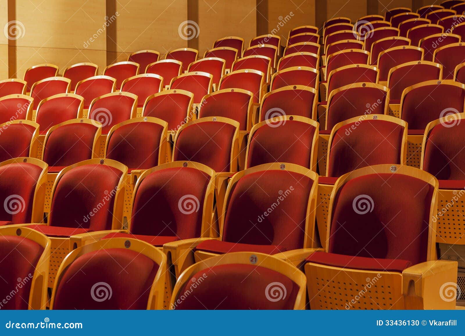 Rows of red theater seats stock photo. Image of plastic - 33436130