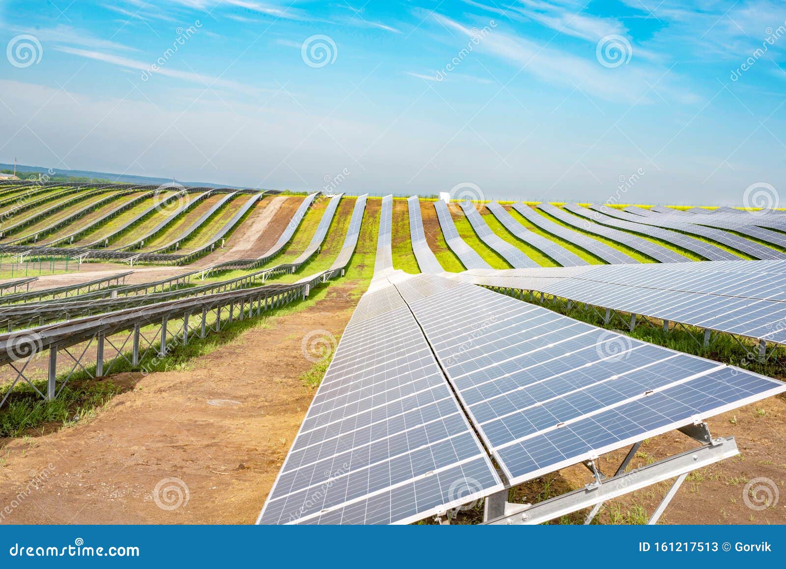 Rows of Solar Panels on the Steep Hills of the Field Stock Image ...