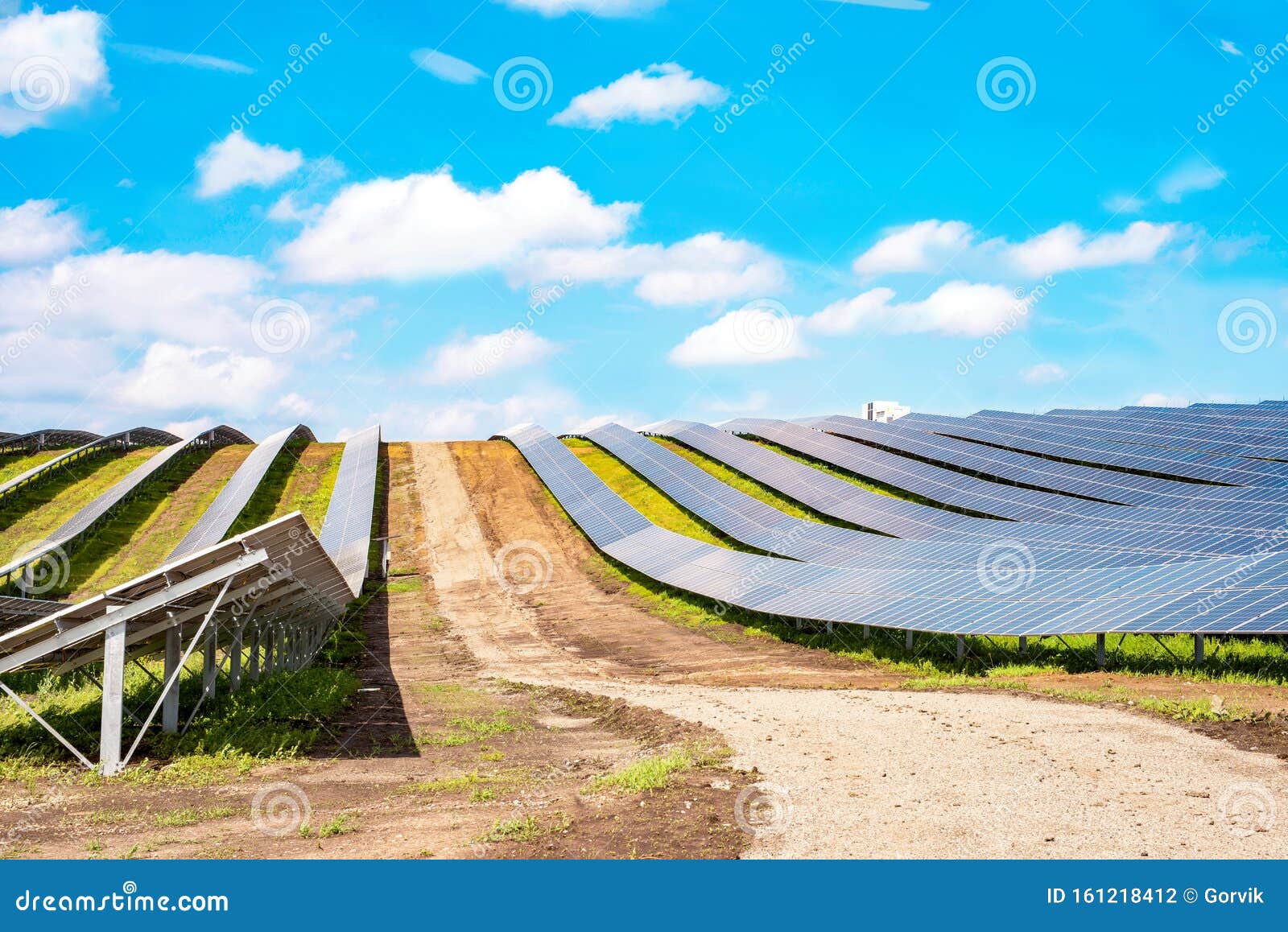 Rows of Solar Panels on the Steep Hills of the Field Stock Photo ...