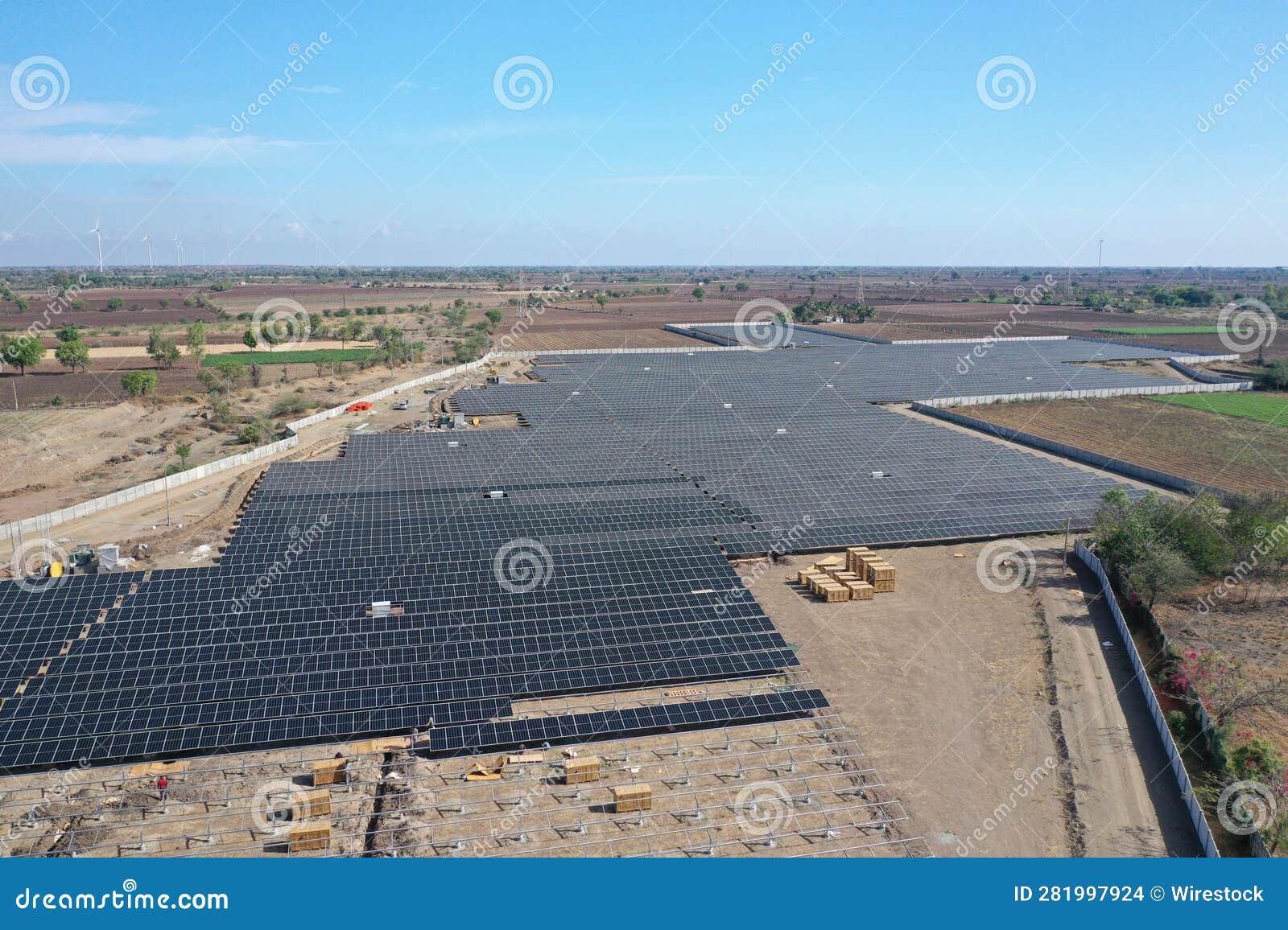 Rows of Solar Panels on Top of a Construction Site Next To Farm Stock ...