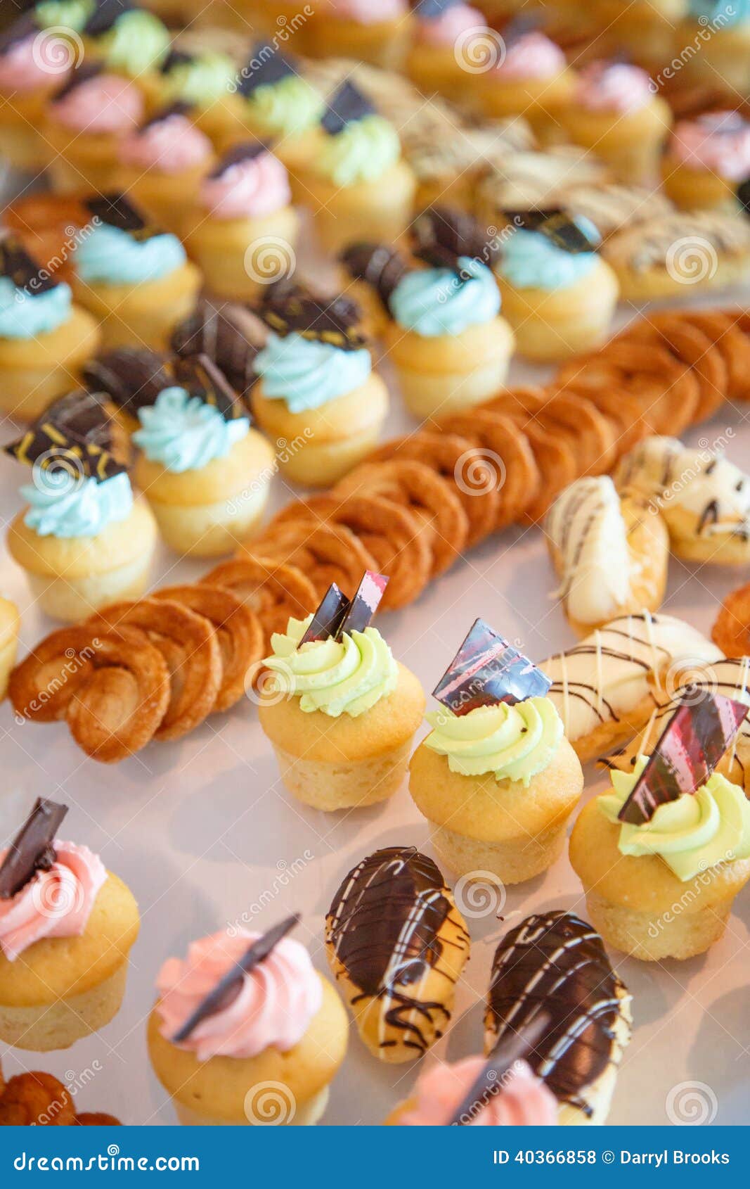 Rows of Sweet Pastries stock photo. Image of cakes, table - 40366858
