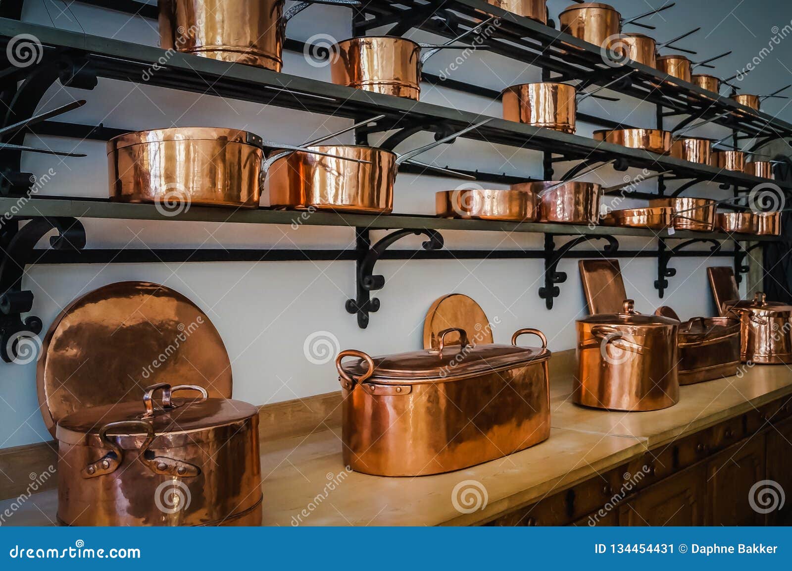Rows of Vintage Copper Pans in Different Size on a Shelf Stock Image ...