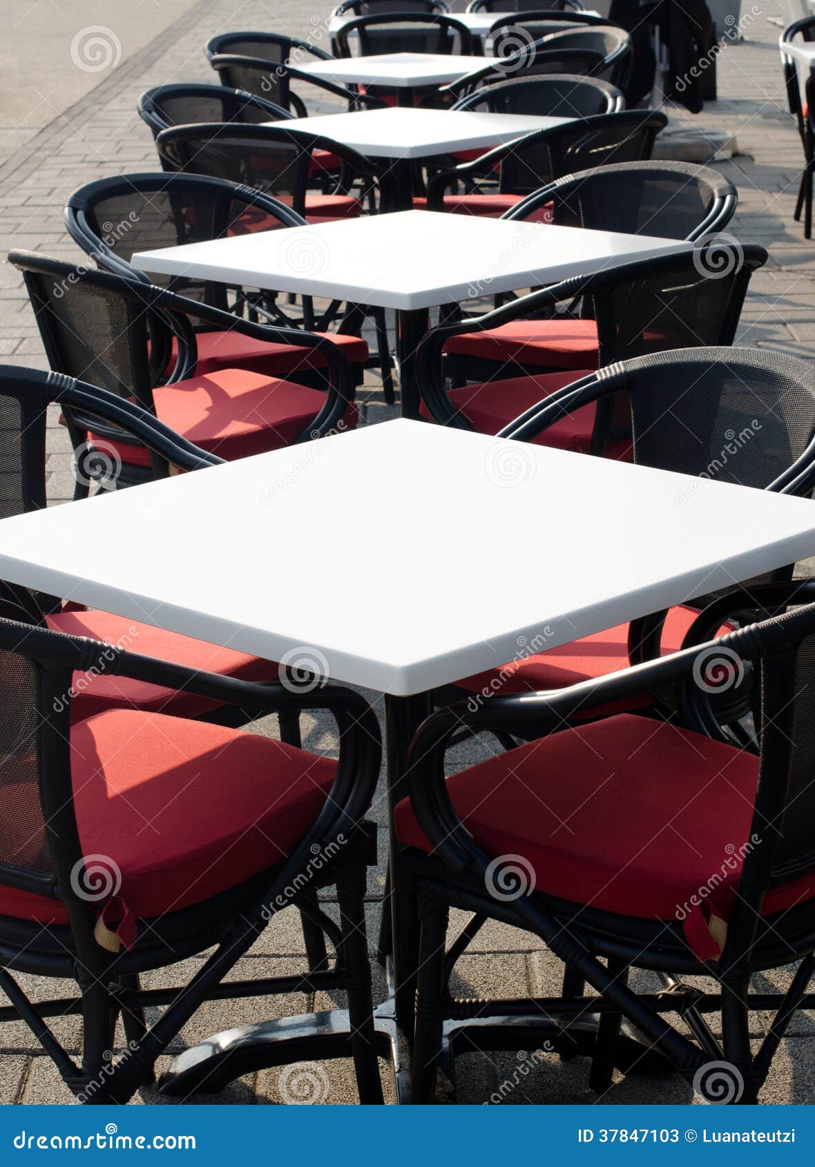 Rows of White Empty Tables and Black Wicker Chairs in an Open Air ...