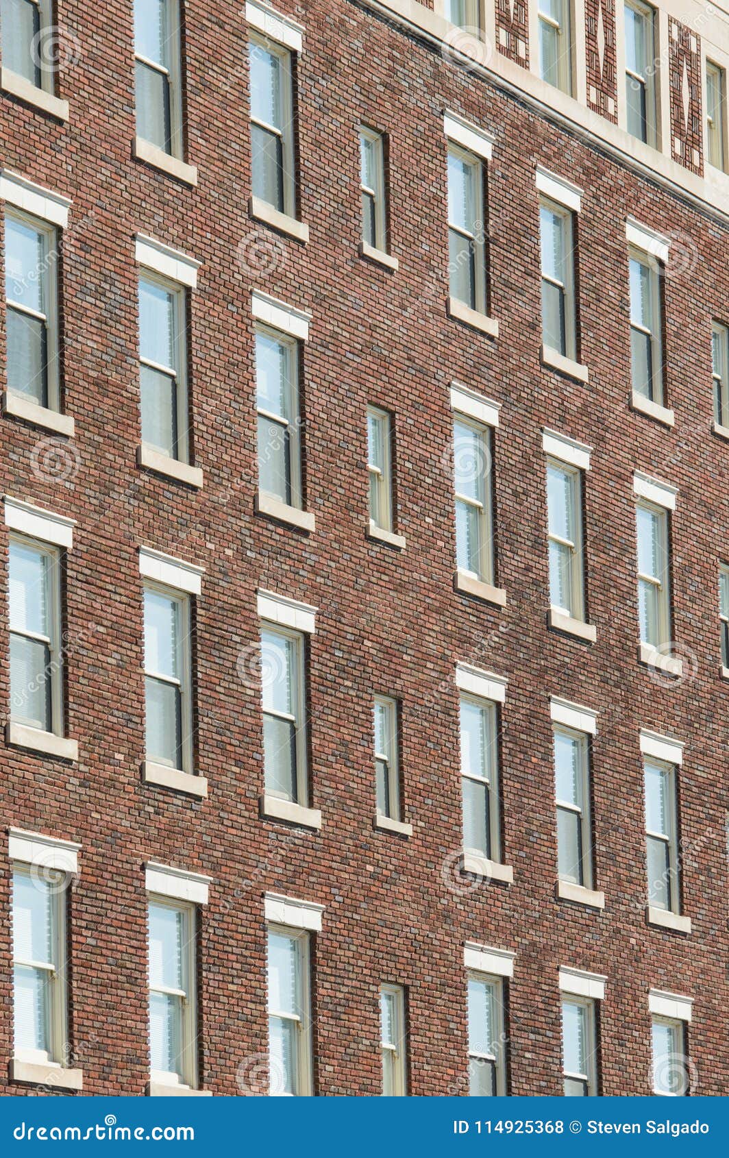 Rows of windows stock photo. Image of building, brick - 114925368