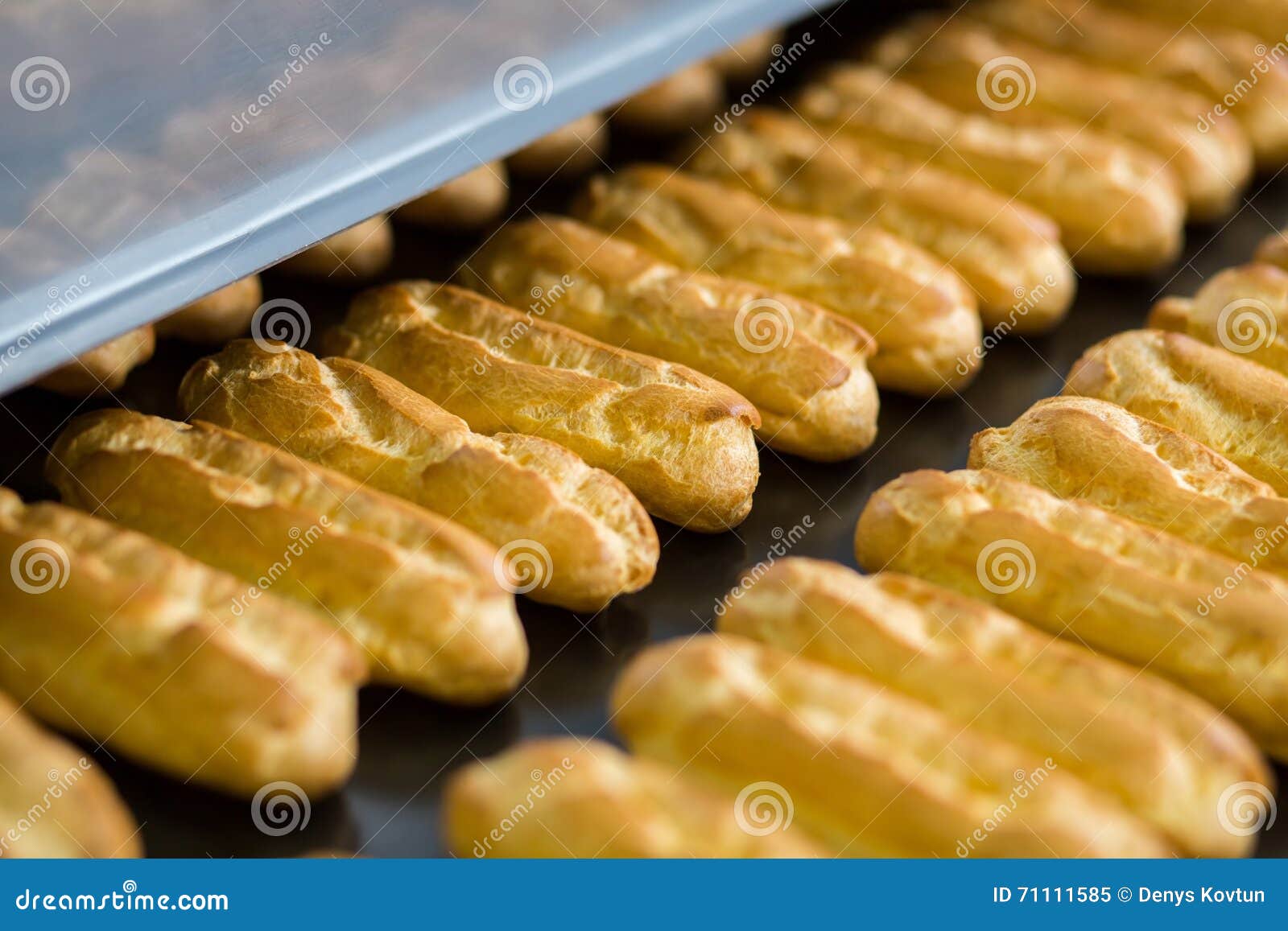 Rows of Yellow Eclair Shells. Stock Image - Image of process, flour ...