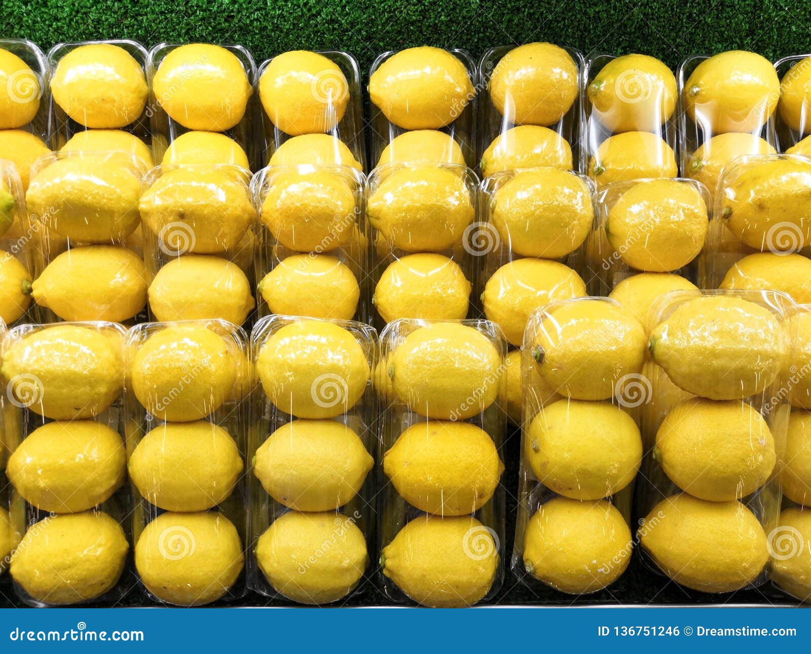 Yellow lemons stock photo. Image of aisle, plastic, display - 136751246