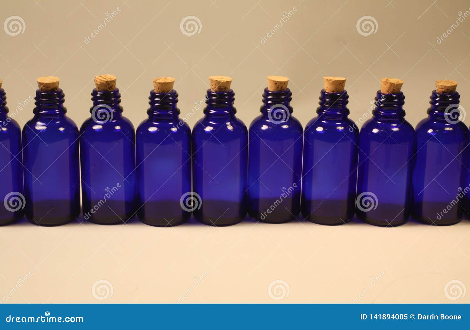 Royal Blue Glass Dropper Bottles with Corks. Stock Image - Image of ...