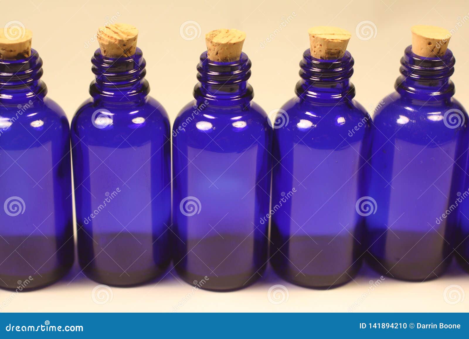 Royal Blue Glass Dropper Bottles with Corks. Stock Photo - Image of ...