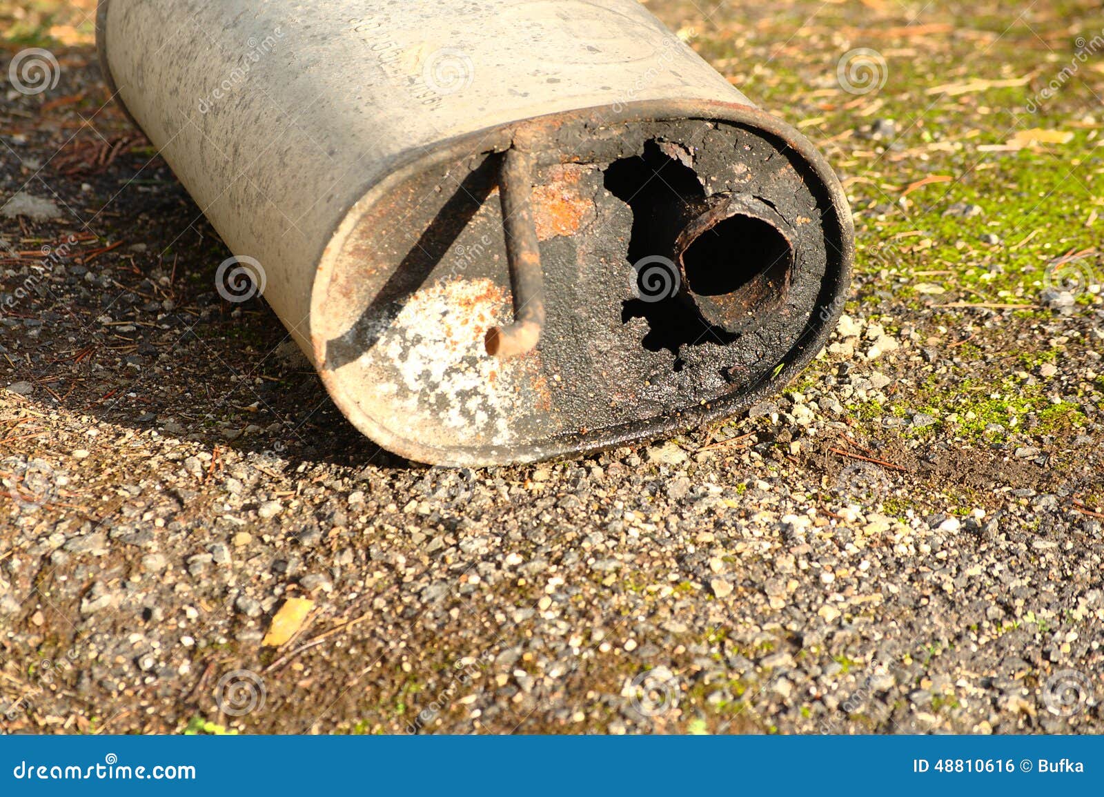 Rrusty exhaust from a car stock photo. Image of muffler - 48810616