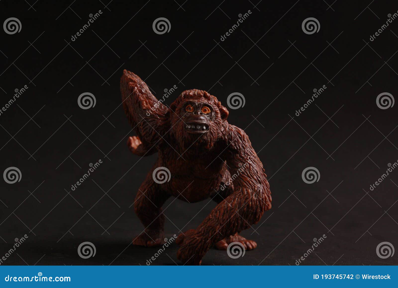 Rubber Ape Toy Isolated on Black Background Stock Photo - Image of ...