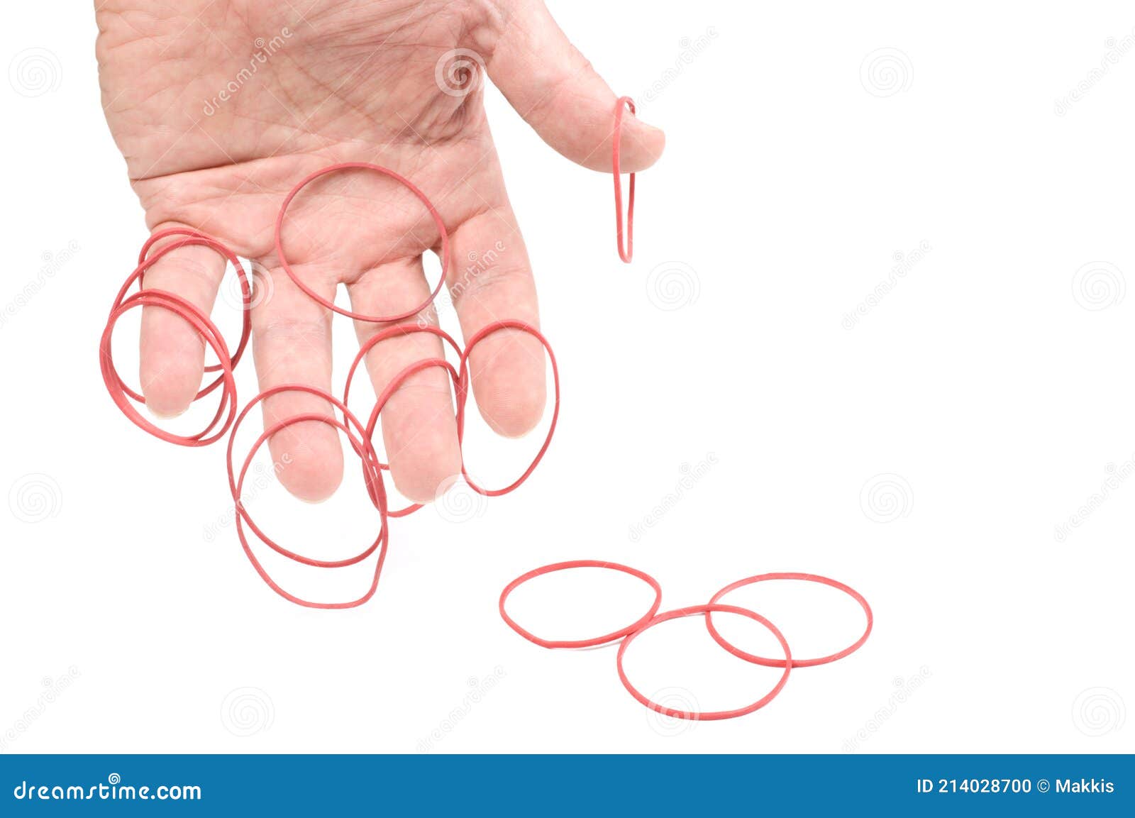 Red rubber bands in hand stock photo. Image of shot - 214028700