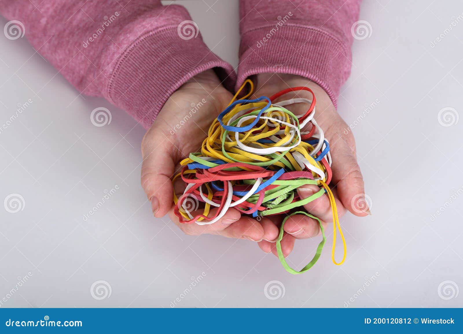 Rubber bands in hands stock photo. Image of rubber, colorful - 200120812