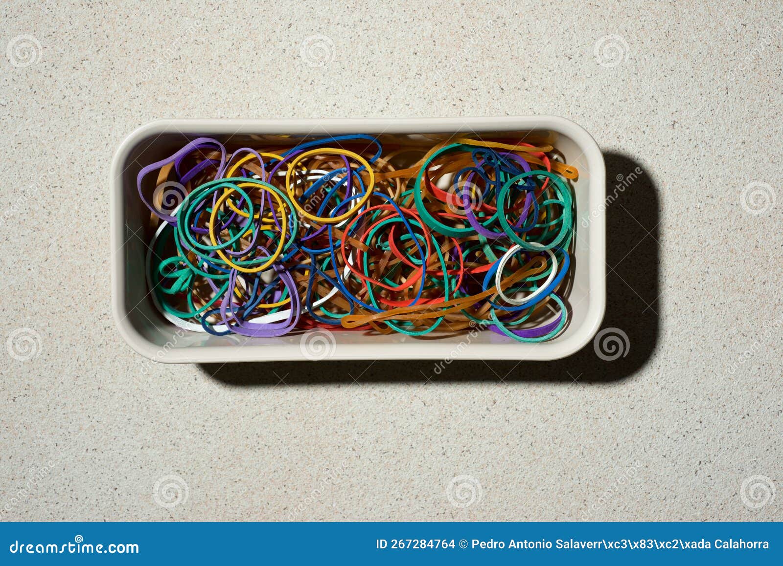 Rubber bands in a long box stock photo. Image of supply - 267284764
