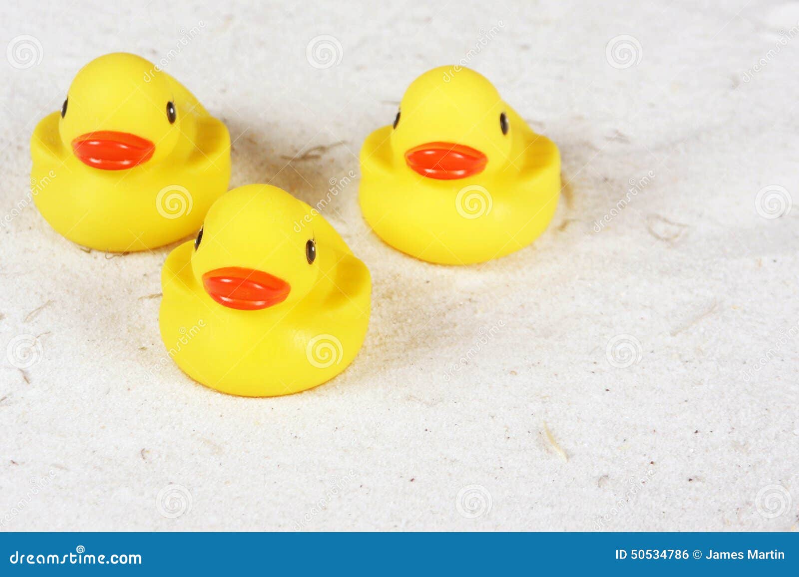 Rubber Ducks In The Sand At The Beach Stock Photography | CartoonDealer ...