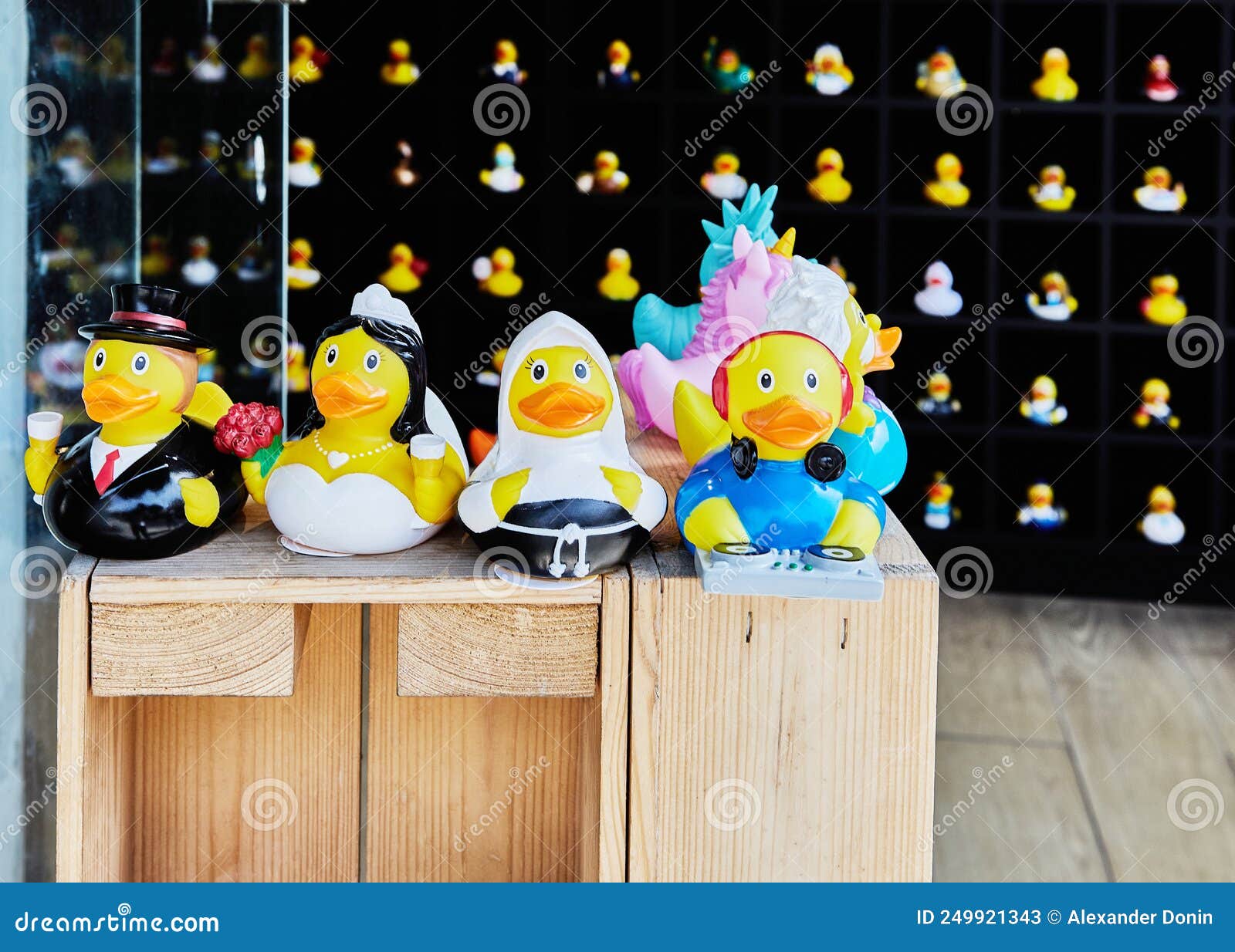 Rubber Ducks Stand on Black Shelves in Different Shapes and Colors ...