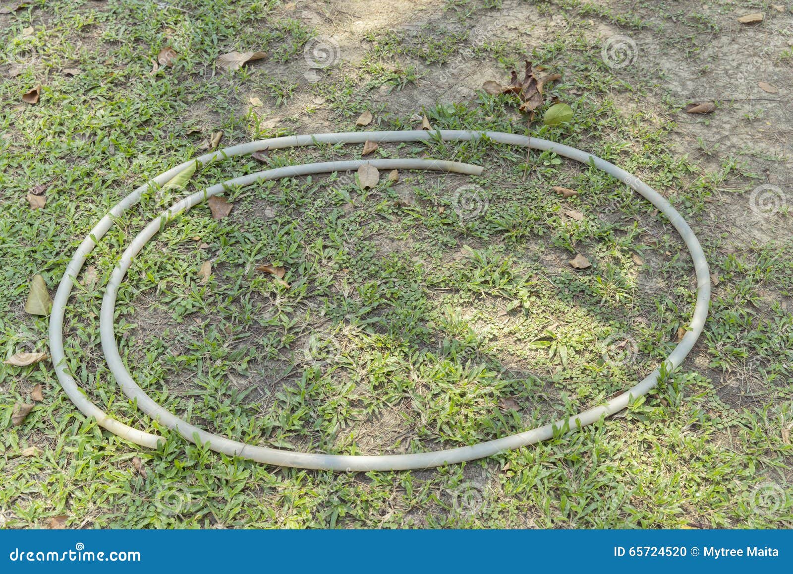 Rubber Hose is Kept in Round Shape on the Ground. Stock Photo - Image ...