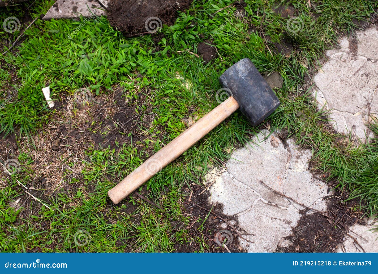 A Rubber Mallet Laying on Grass Stock Photo - Image of black, ground ...