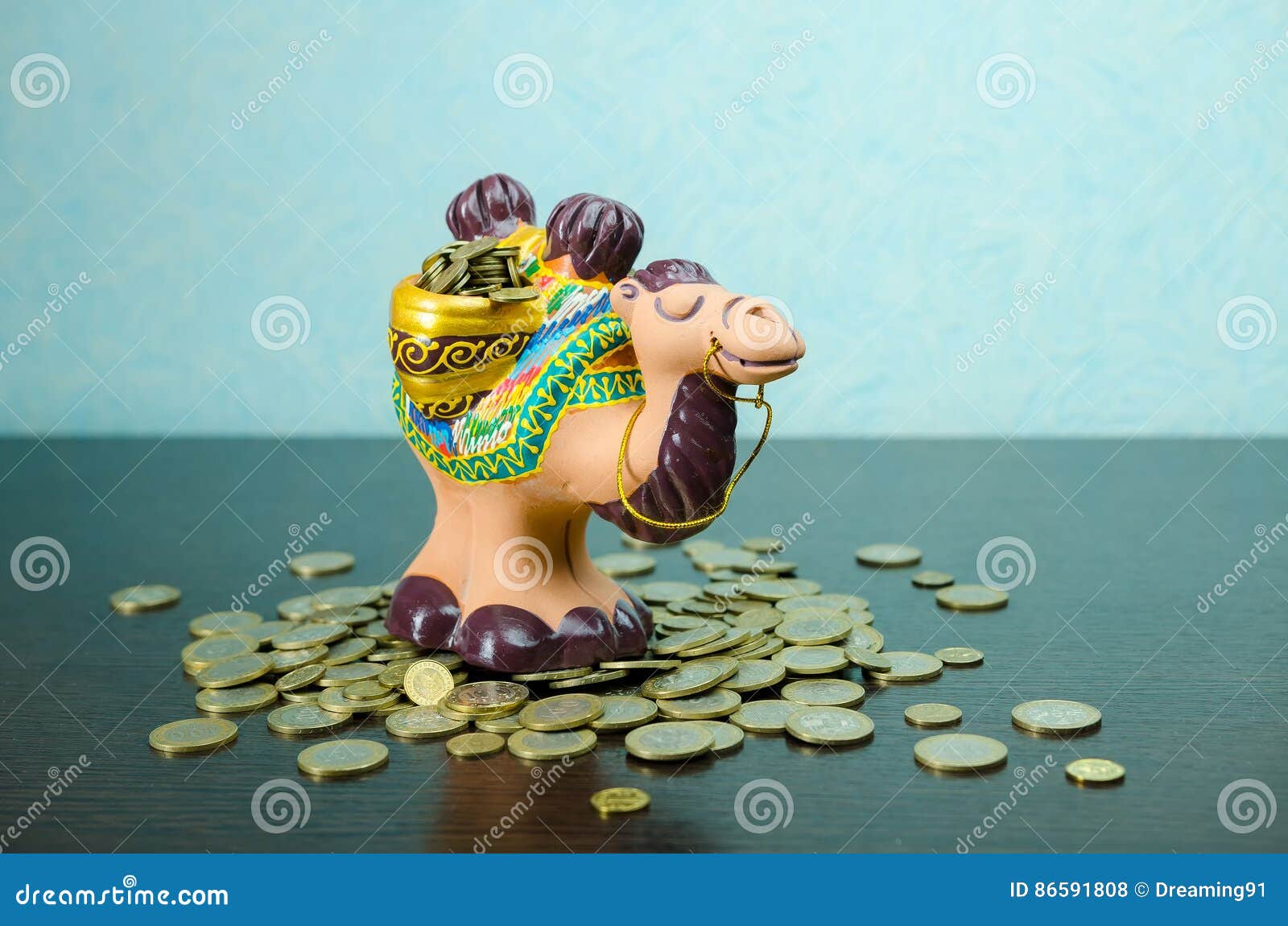 A Rubber Toy of Camel Side View and Coins. Stock Photo - Image of gold ...