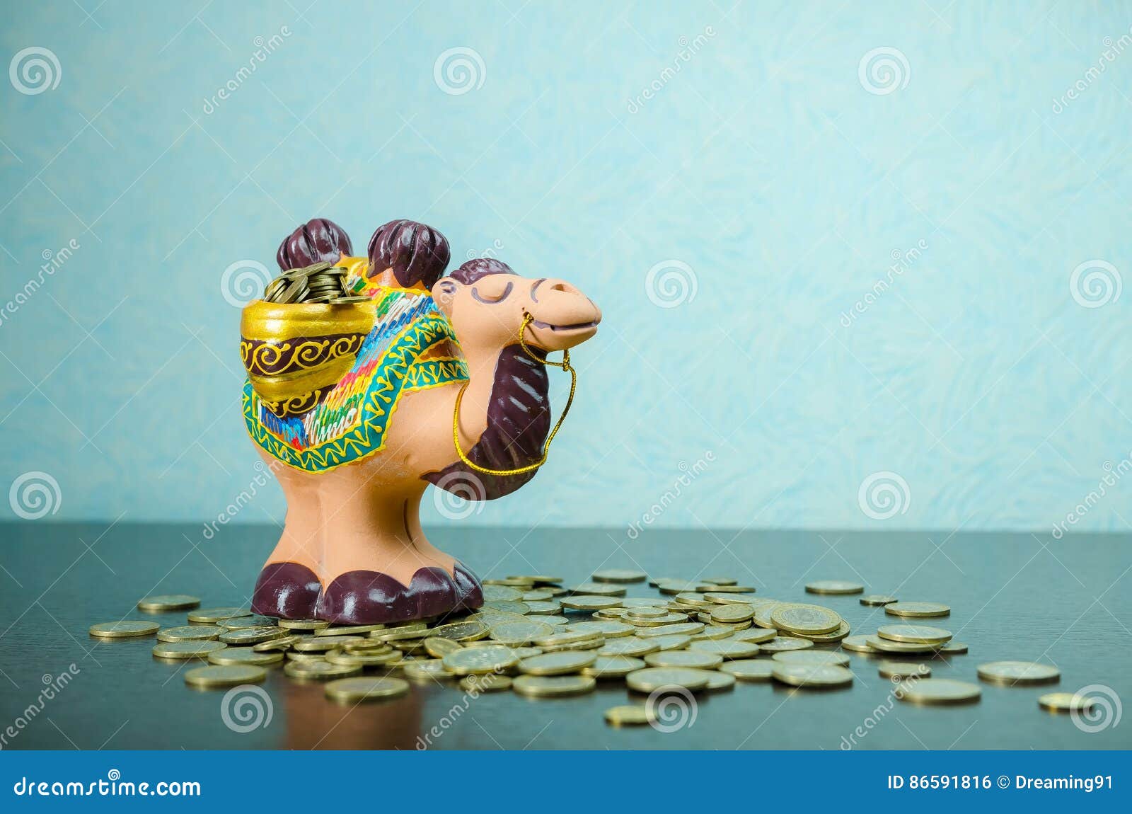 A Rubber Toy of Camel Side View and Coins. Stock Photo - Image of ...