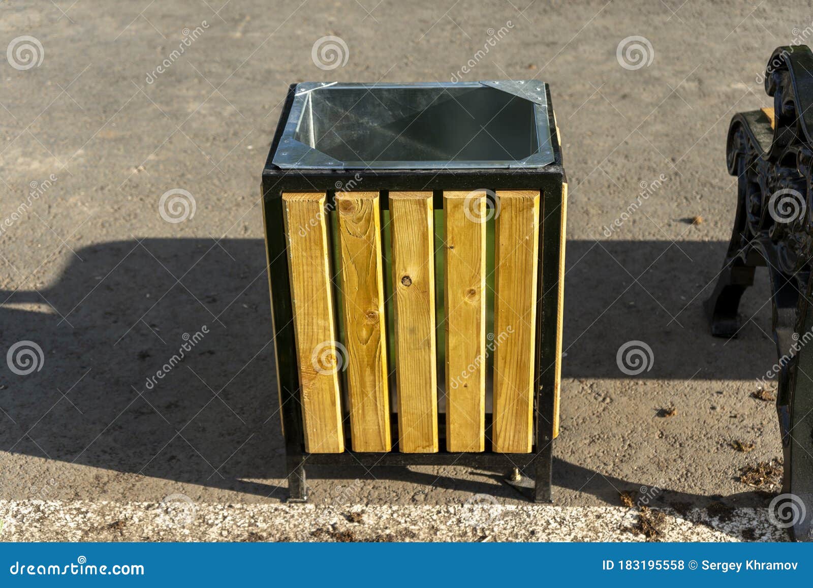 Rubbish Box in the Park. Yellow Garbage Bin Inside a Wooden Enclosure ...