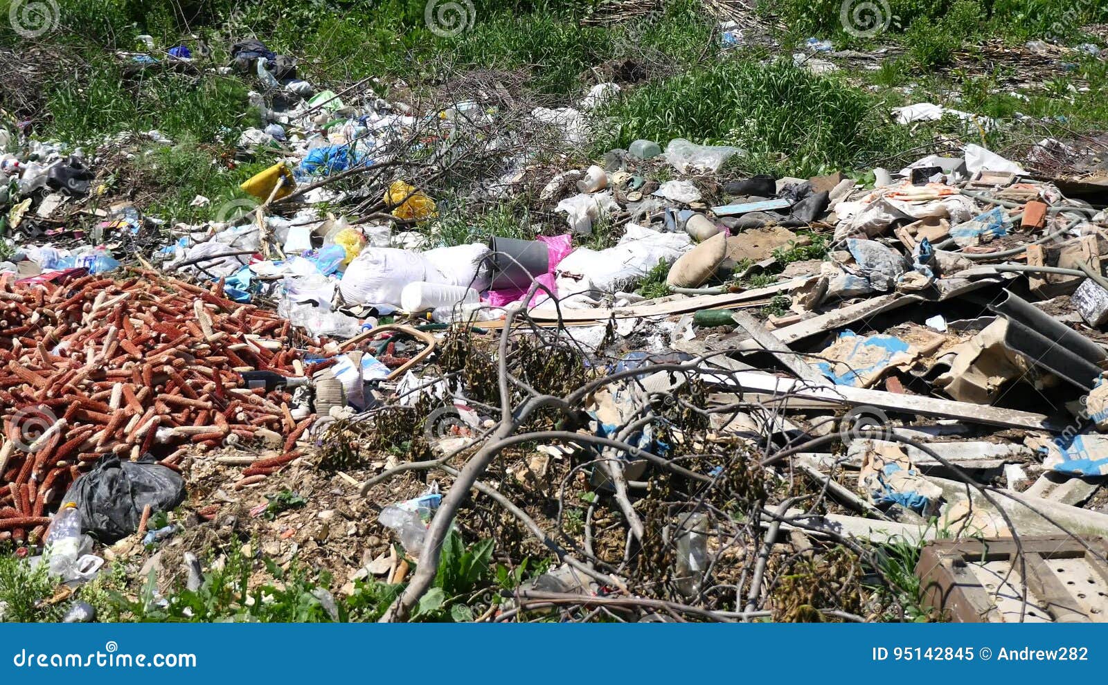 Rubbish in the green grass stock image. Image of dump - 95142845