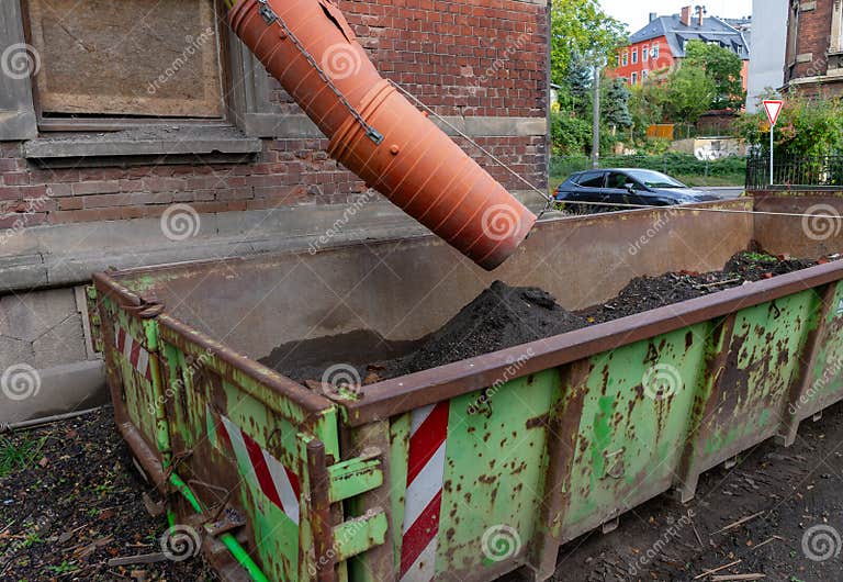 Rubble Chute with Container on a Construction Site for Construction ... Rubble Chute with Container on a Construction Site for Construction ...