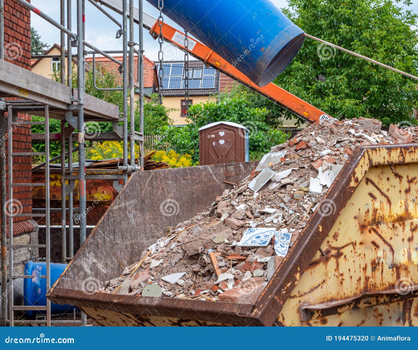 Rubble Chute with Debris and Container on a Construction Site Stock ...