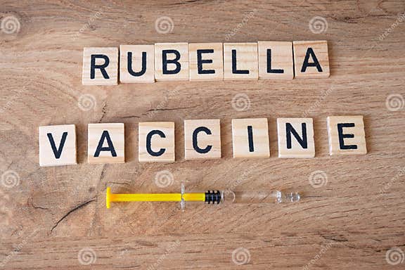 Rubella Vaccination Concept. Syringe on the Table Stock Photo - Image ...