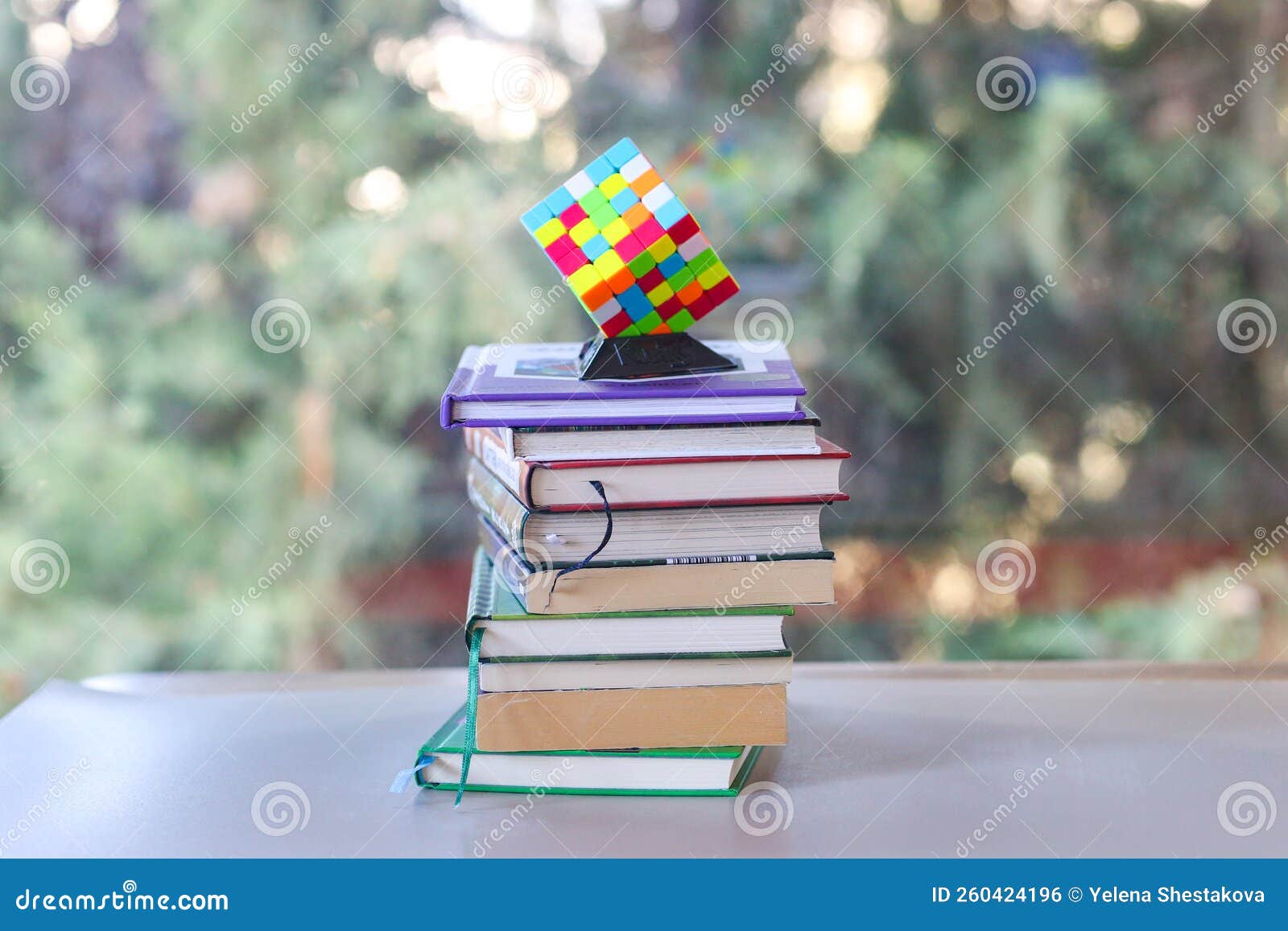 Rubik s Cube on the books editorial photo. Image of rubiks - 260424196