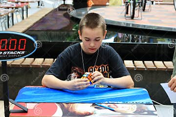 Rubik`s cube competition editorial photography. Image of male - 14992142