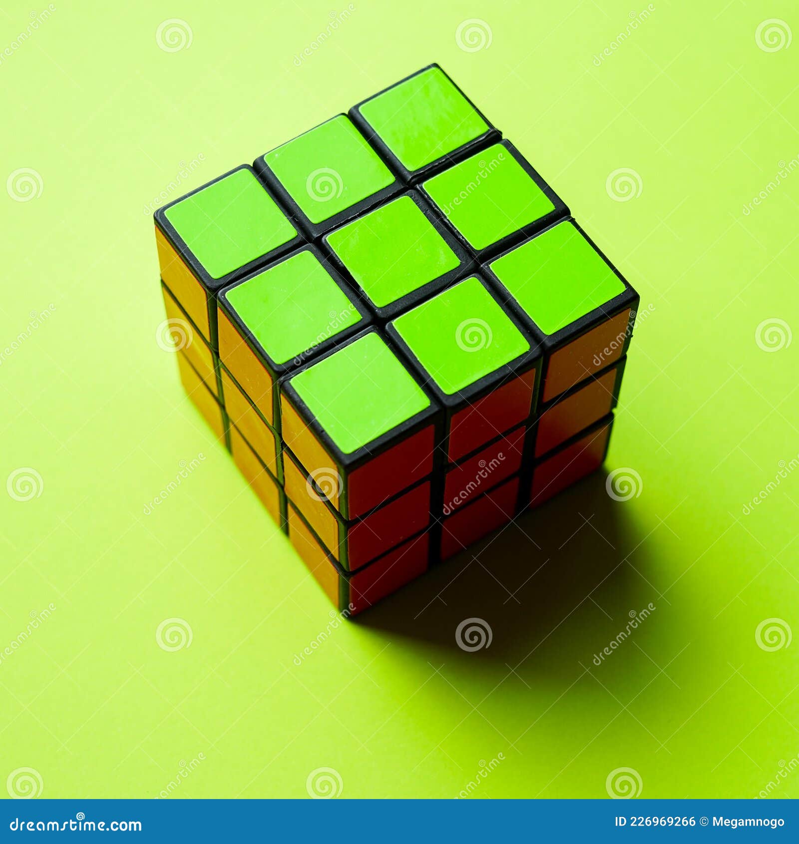 Rubik`s Cube Green Side on a Table with Black Shadow Editorial Photo ...