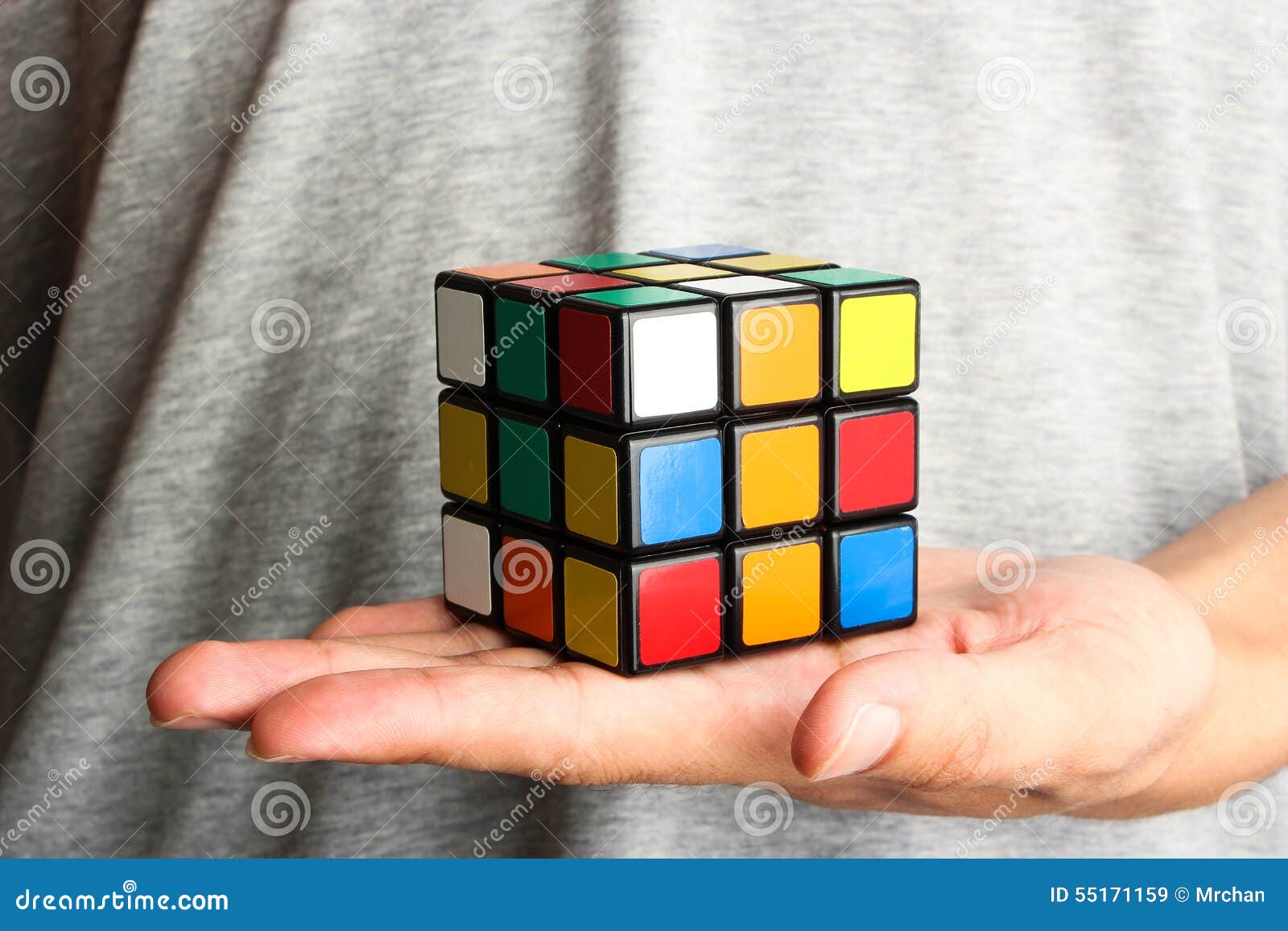Rubik s Cube in hand editorial stock image. Image of dice - 55171159
