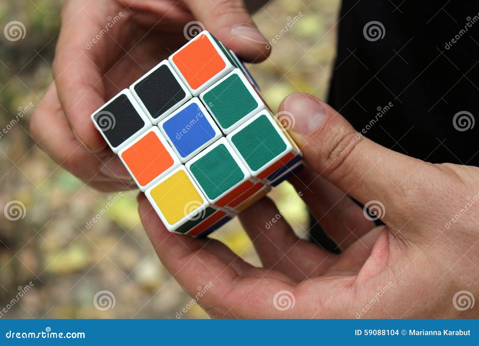Rubik s cube in his hands. editorial stock image. Image of solution ...