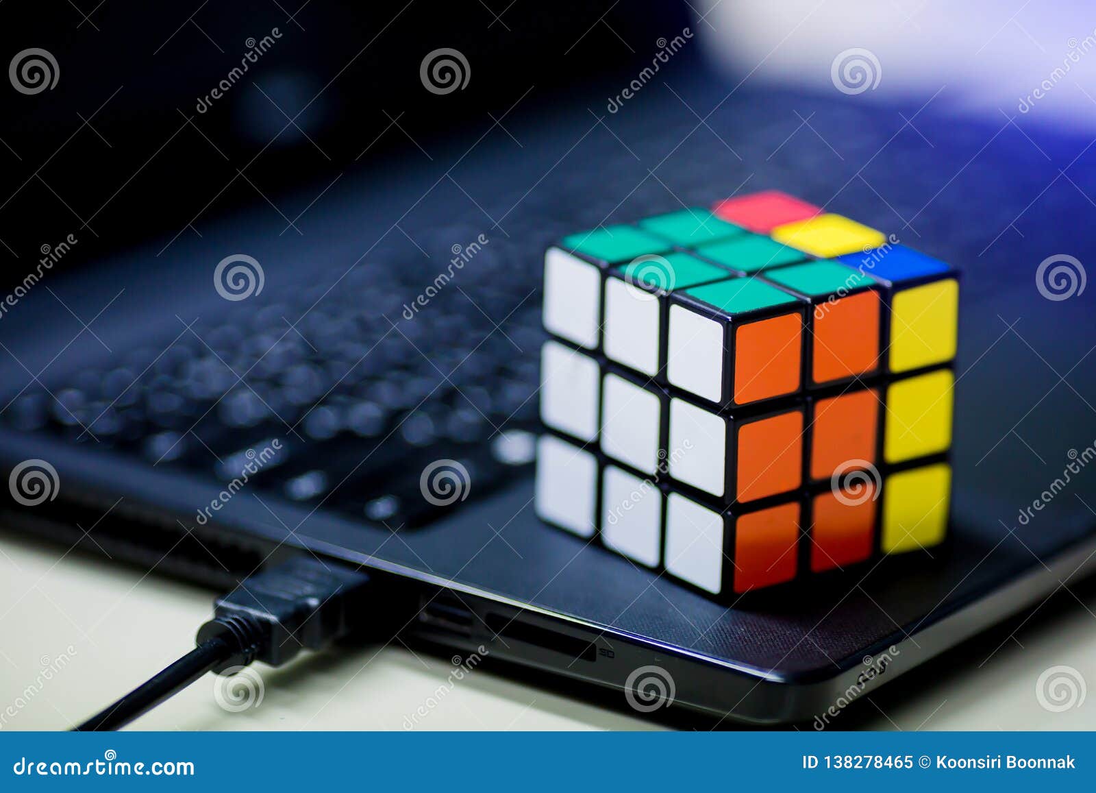 Rubik`s Cube on Laptop. Techincal and Business Solving Problem ...