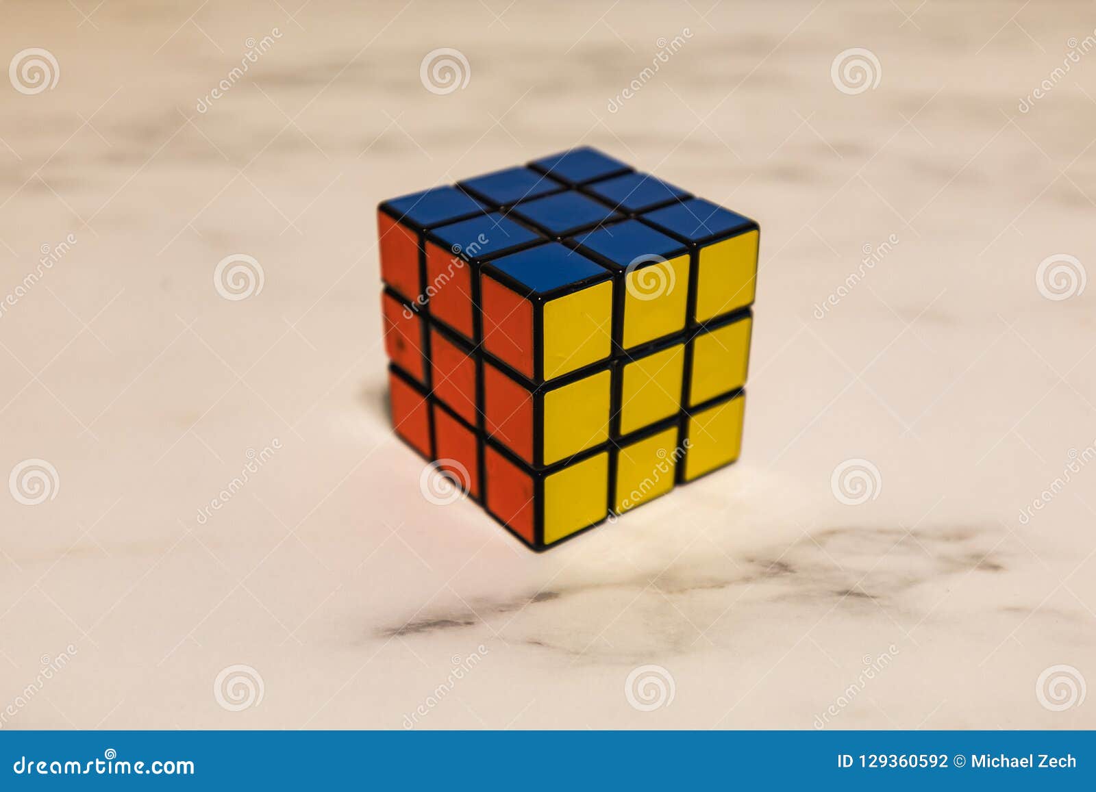 Rubik`s Cube on a Marble Plate, Showing Blue, Yellow and Red Editorial ...