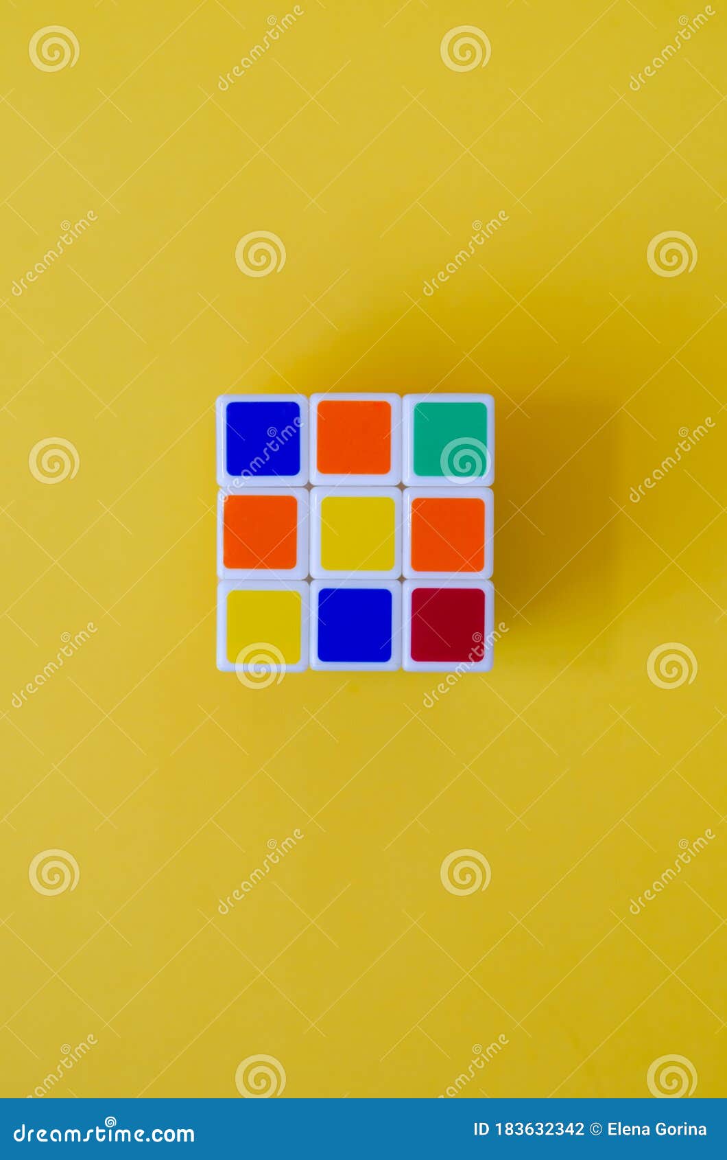Rubik S Cube on a Yellow Background Editorial Photography - Image of ...