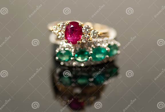 Ruby and Emerald Rings in Diamond Settings Stock Image - Image of white ...