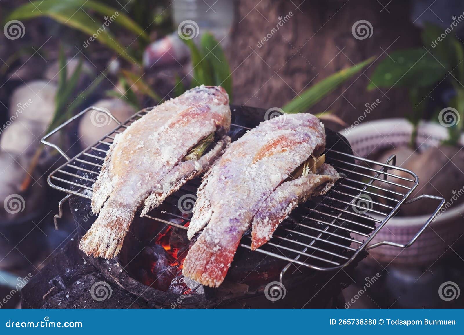 The Ruby Fish is Coated with Salt and Placed on a Charcoal Grill in a ...