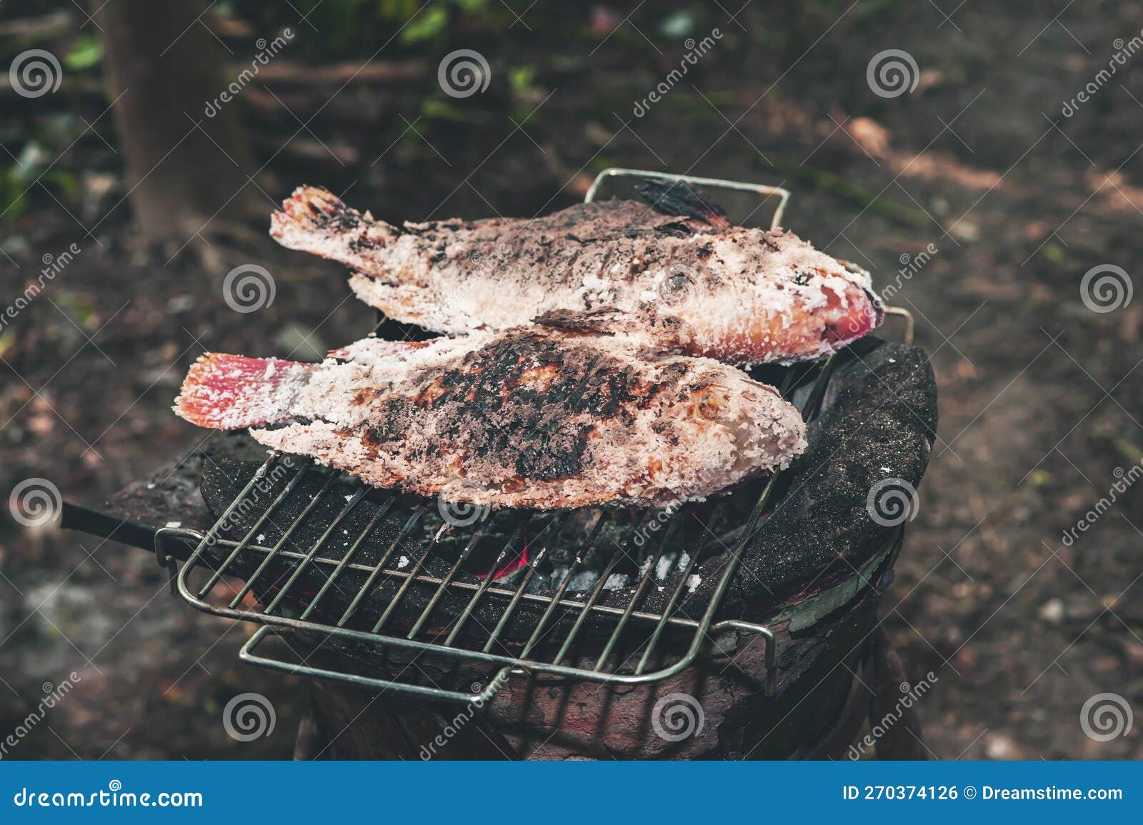 The Ruby Fish is Coated with Salt and Placed on a Charcoal Grill in a ...