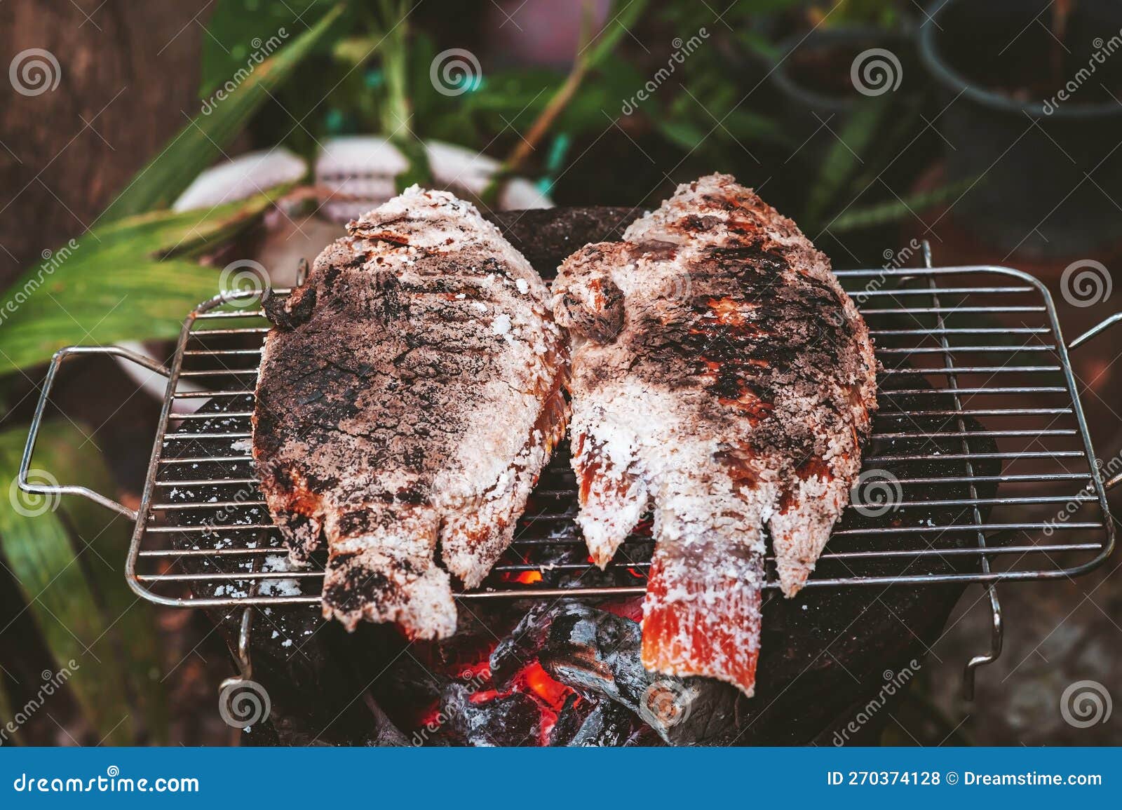 The Ruby Fish is Coated with Salt and Placed on a Charcoal Grill in a ...