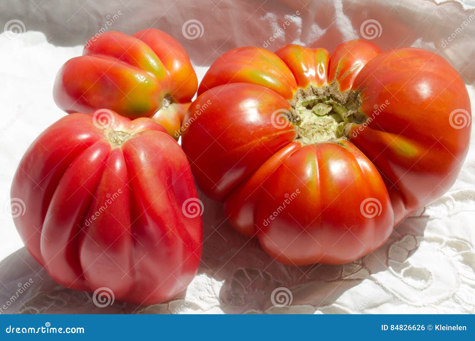 Ruffled heirloom tomatoes stock photo. Image of juicy - 84826626