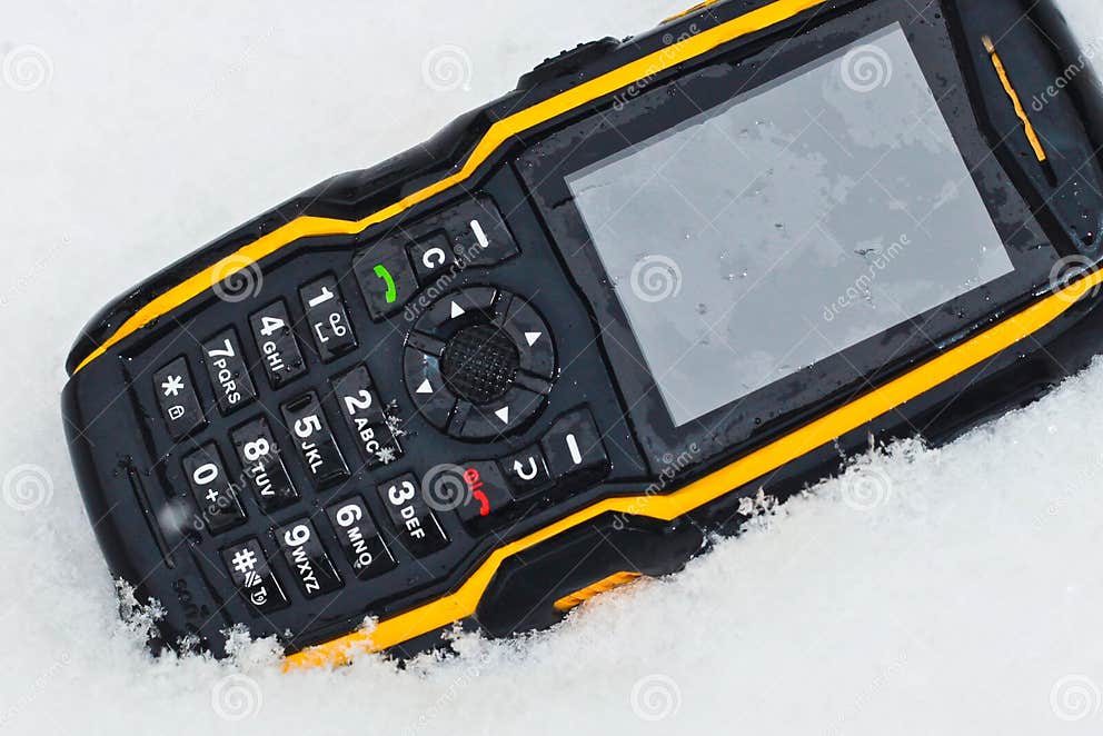 Rugged Cellphone in snow stock image. Image of mobile - 23321247