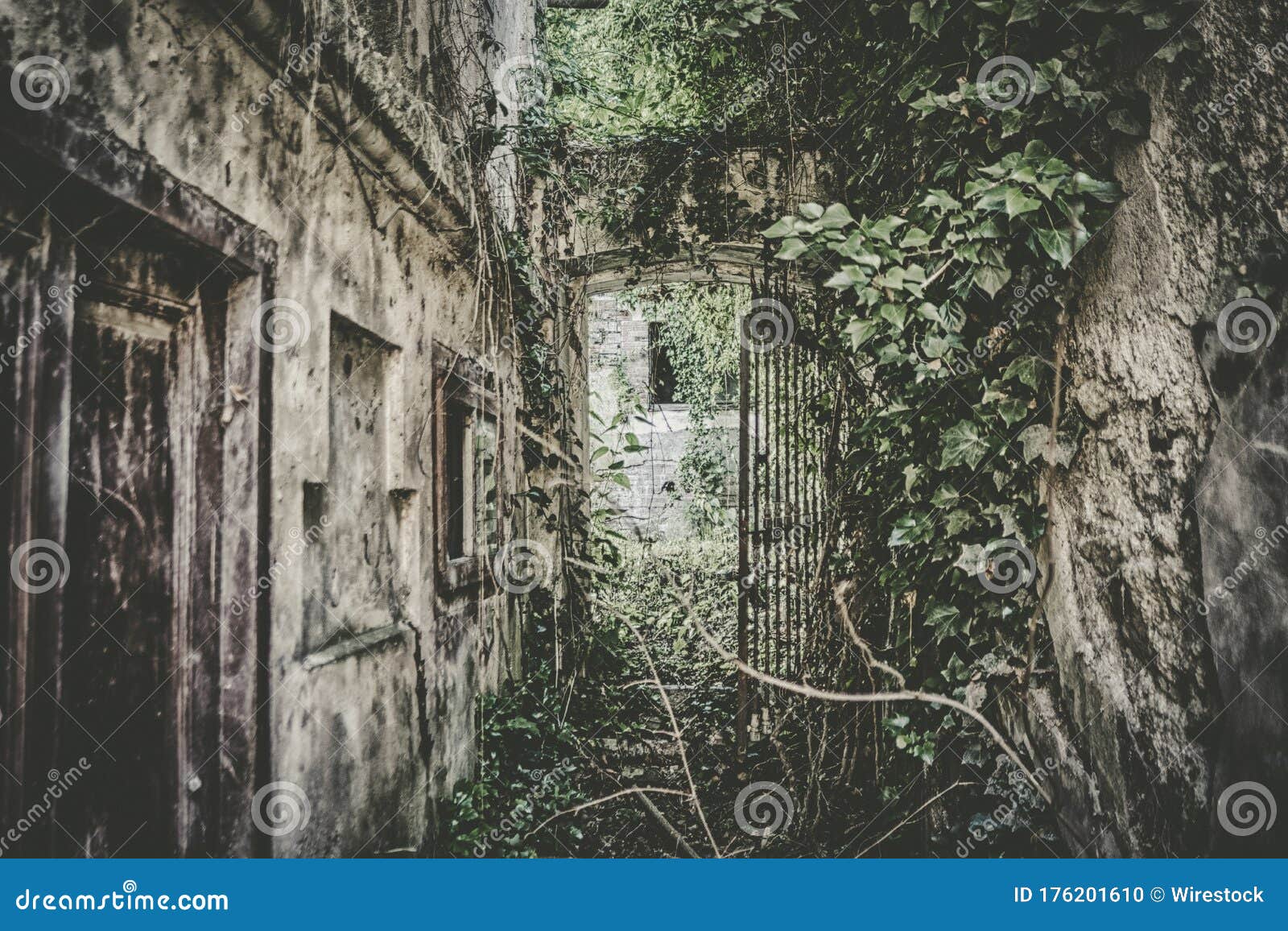 Ruined Building and Narrow Path with a Fence Stock Photo - Image of ...
