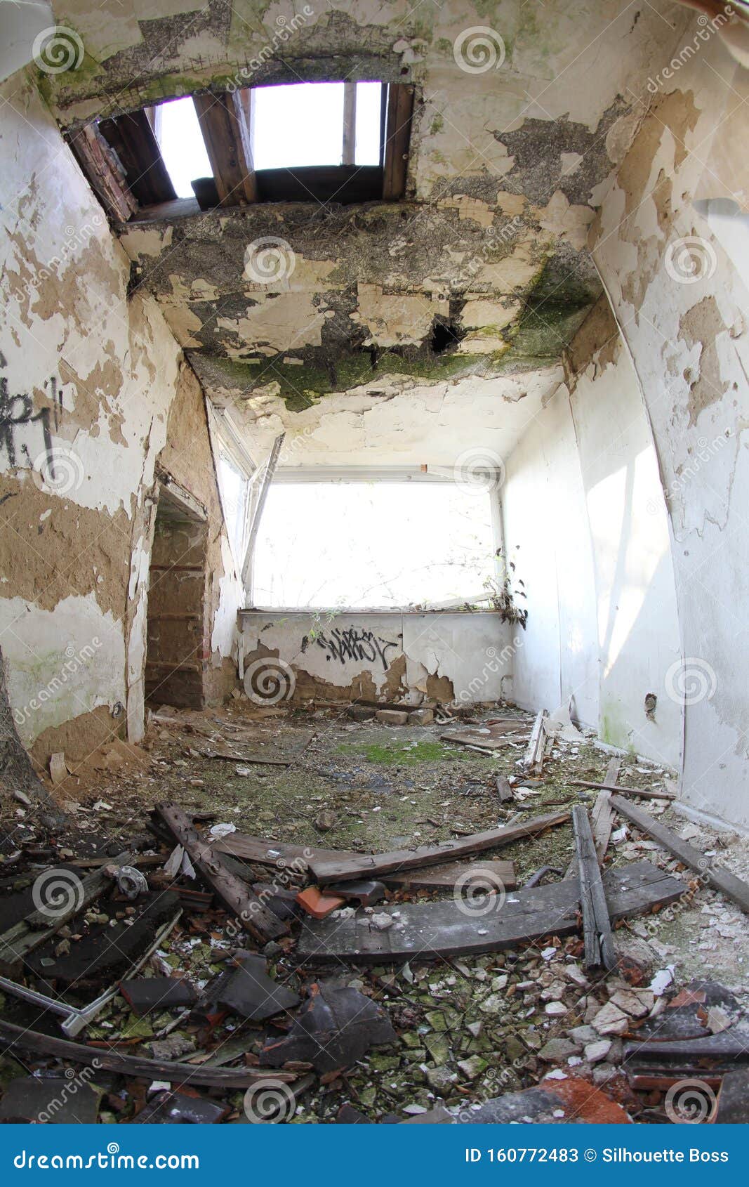 Ruined Room With Holes In Wall, Ceiling And Broken Windows In A Loft ...