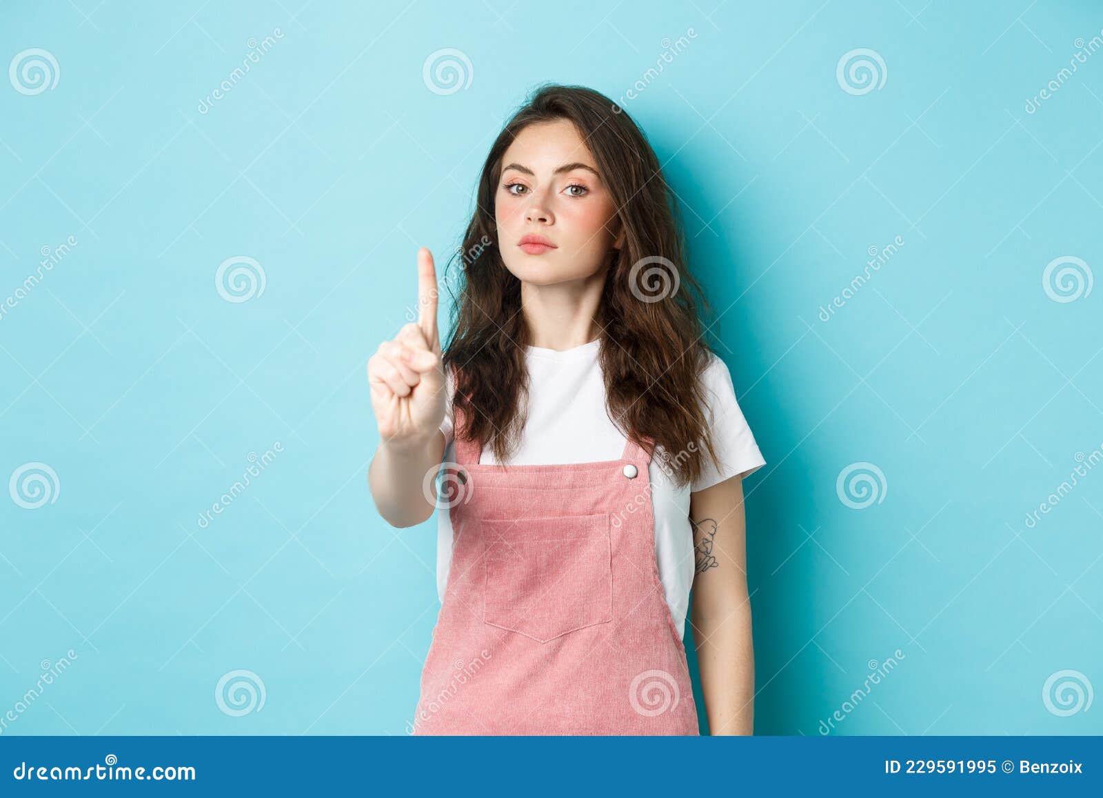 Rule Number One Serious Young Beautiful Girl Shaking Finger In